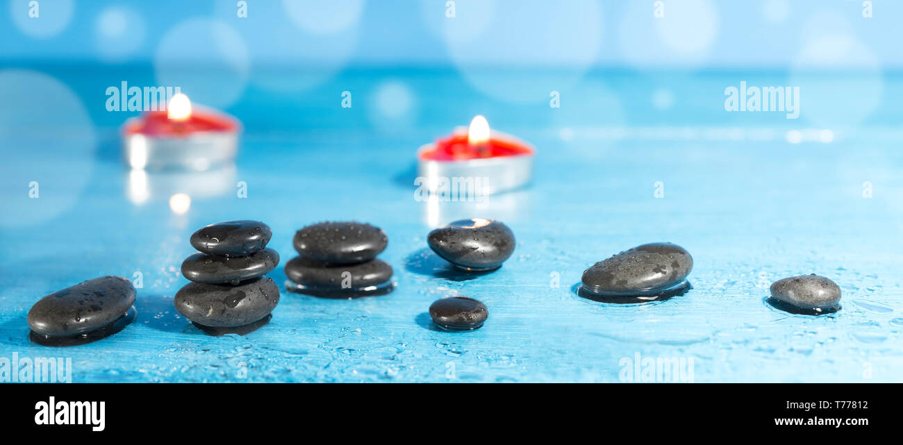 Zen background with the burning candle Stock Photo - Alamy