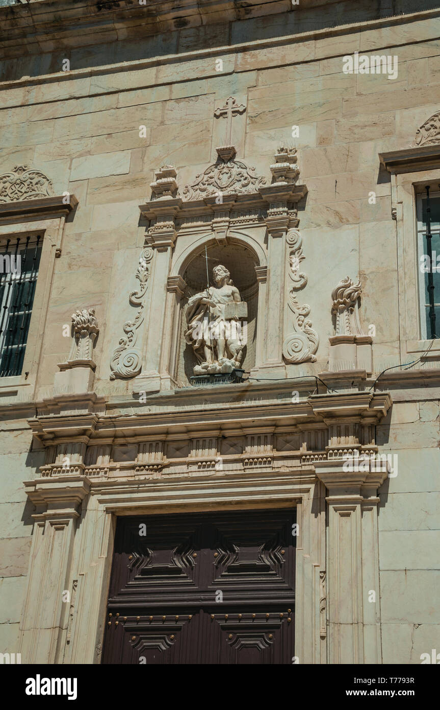 Niche sculpture above the entrance door on church facade carved in ...