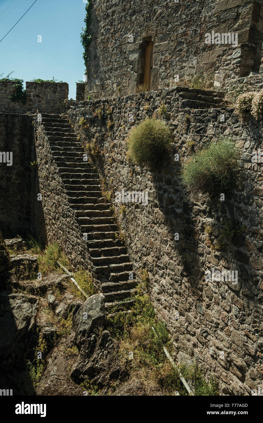 Stone staircase going up the wall with merlons and squared tower at the ...