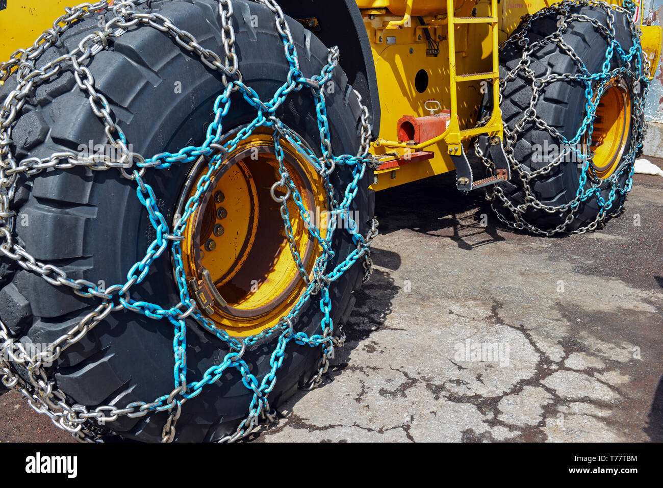 Tire chains for better traction in snow and ice travel on large ...