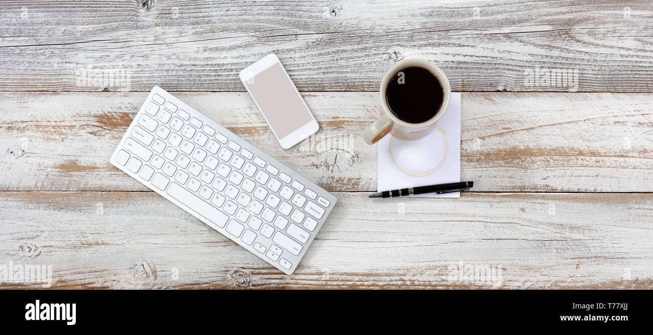Top view of functional desktop with various office equipment and dark ...