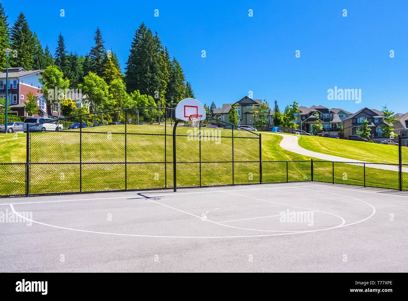 Basketball court within big park area in residential neighborhood Stock ...