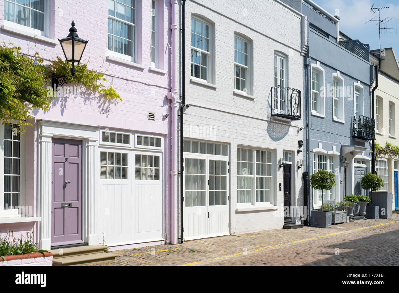 White house with a grey front door in Princes Gate Mews, Kensington ...
