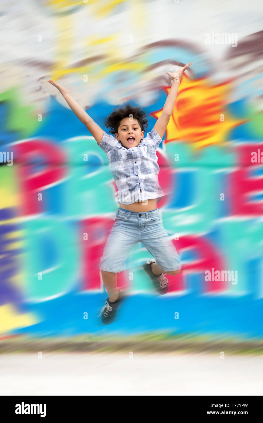 Child leaping hi-res stock photography and images - Alamy