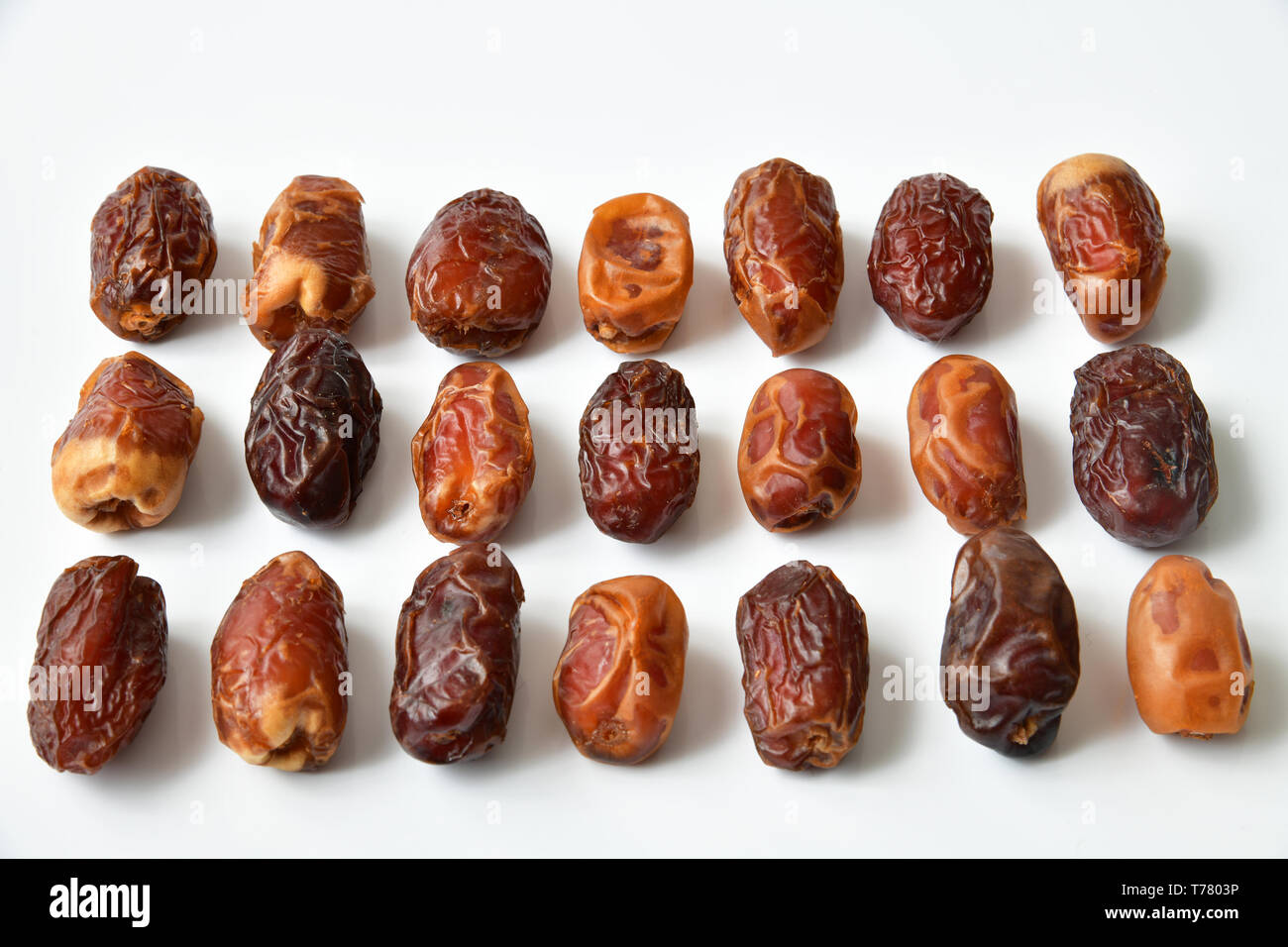 Different varieties of dried dates isolated on white background Stock ...