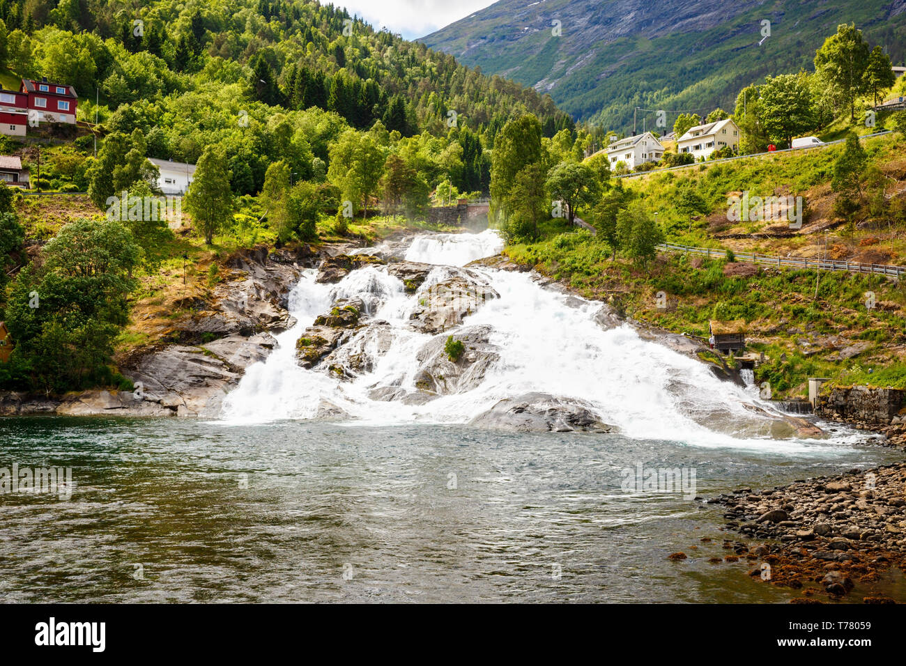 Landscape with mountains, houses and river in Hellesylt, Norway Stock ...