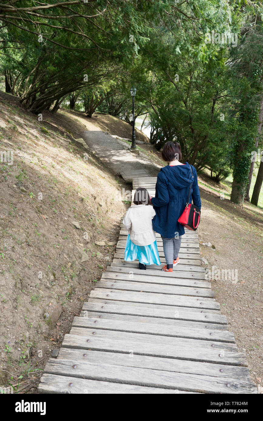 A little girl with mother on the stares Stock Photo - Alamy