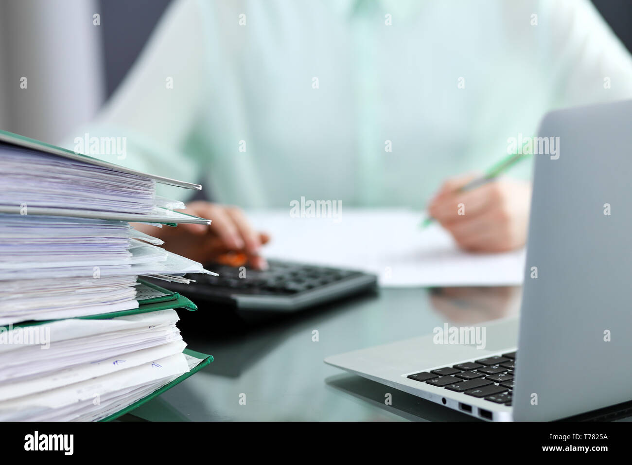 Bookkeeper or financial inspector making report, calculating or ...