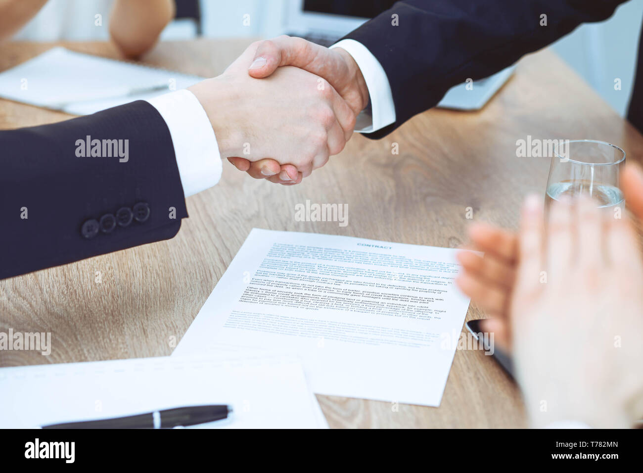 Business people shaking hands at meeting or negotiation in the office ...