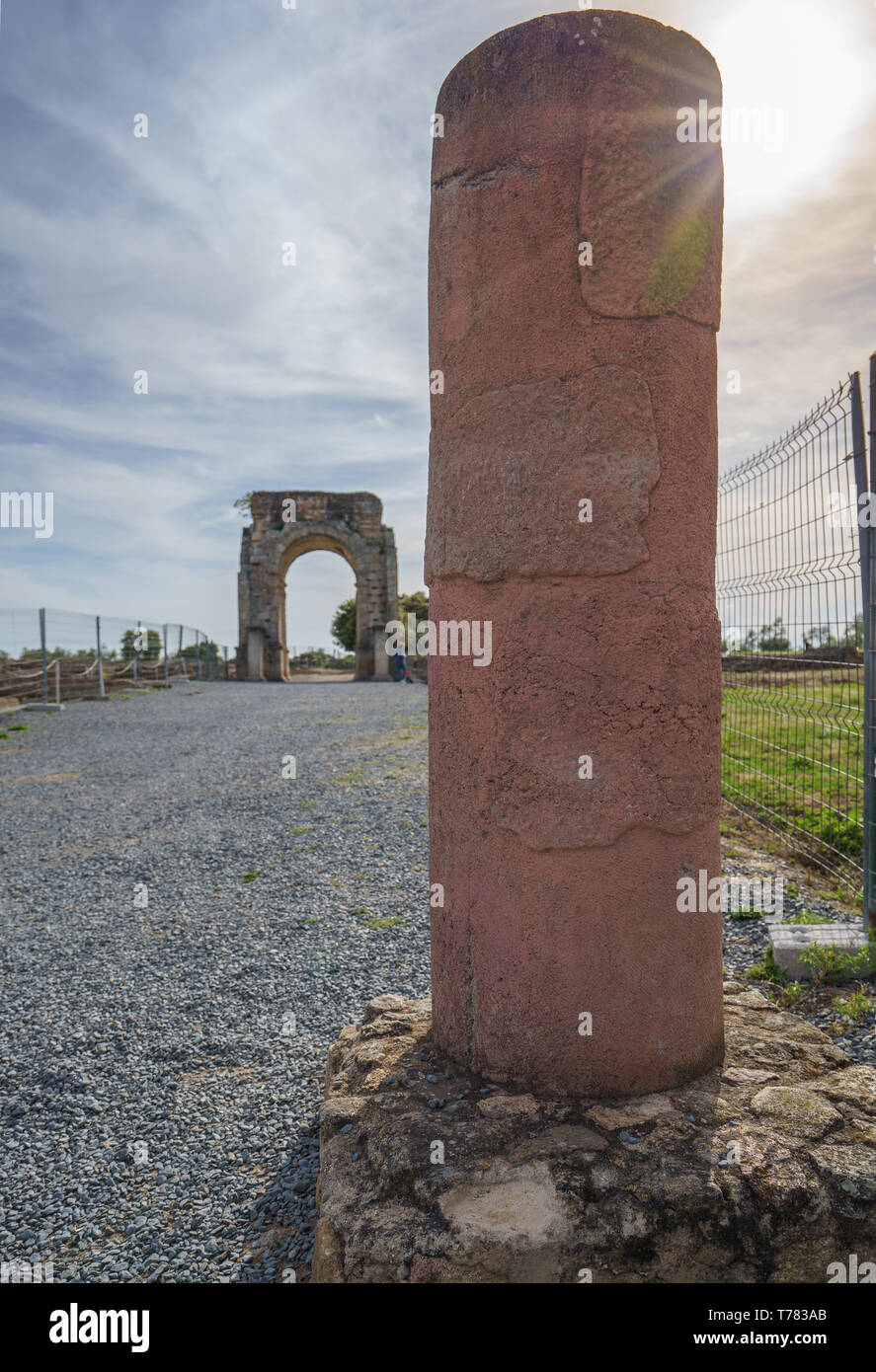 Column and Arch of Caparra, ancient roman city of Caparra in ...