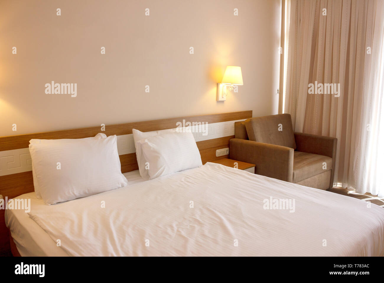 Double bed with white linens, prepared for bedtime and sleeping Stock ...