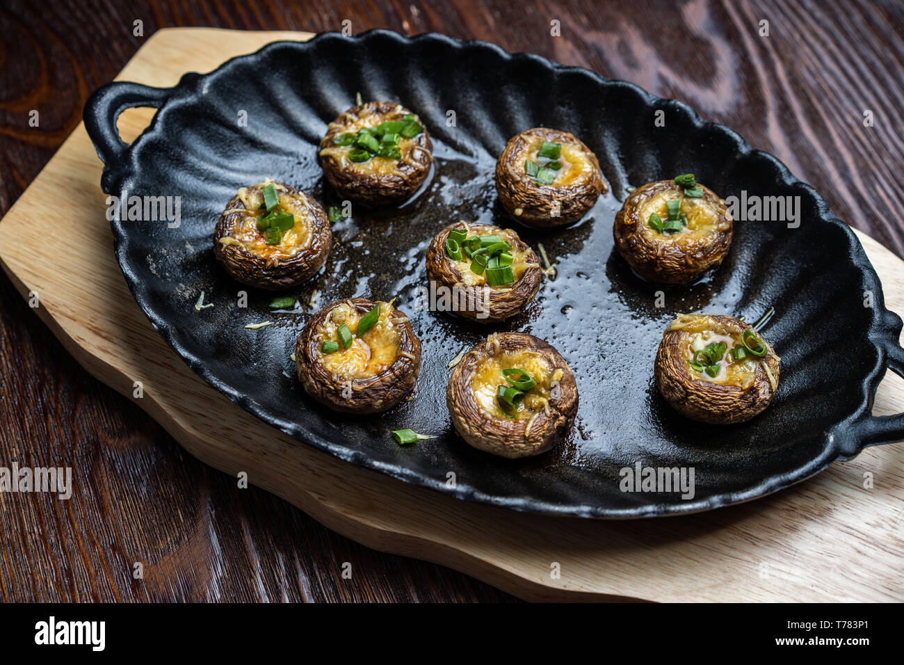 Traditional Italian Mushroom Caps stuffed with Feta as close-up in a ...