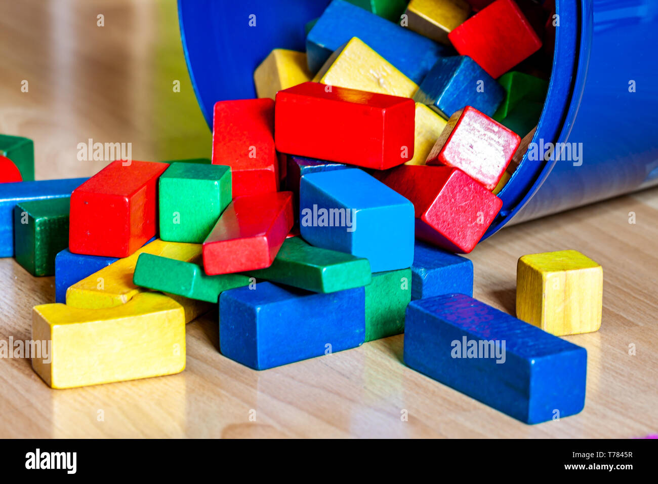 Colorful wooden building blocks on floor - Selective focus Stock Photo ...