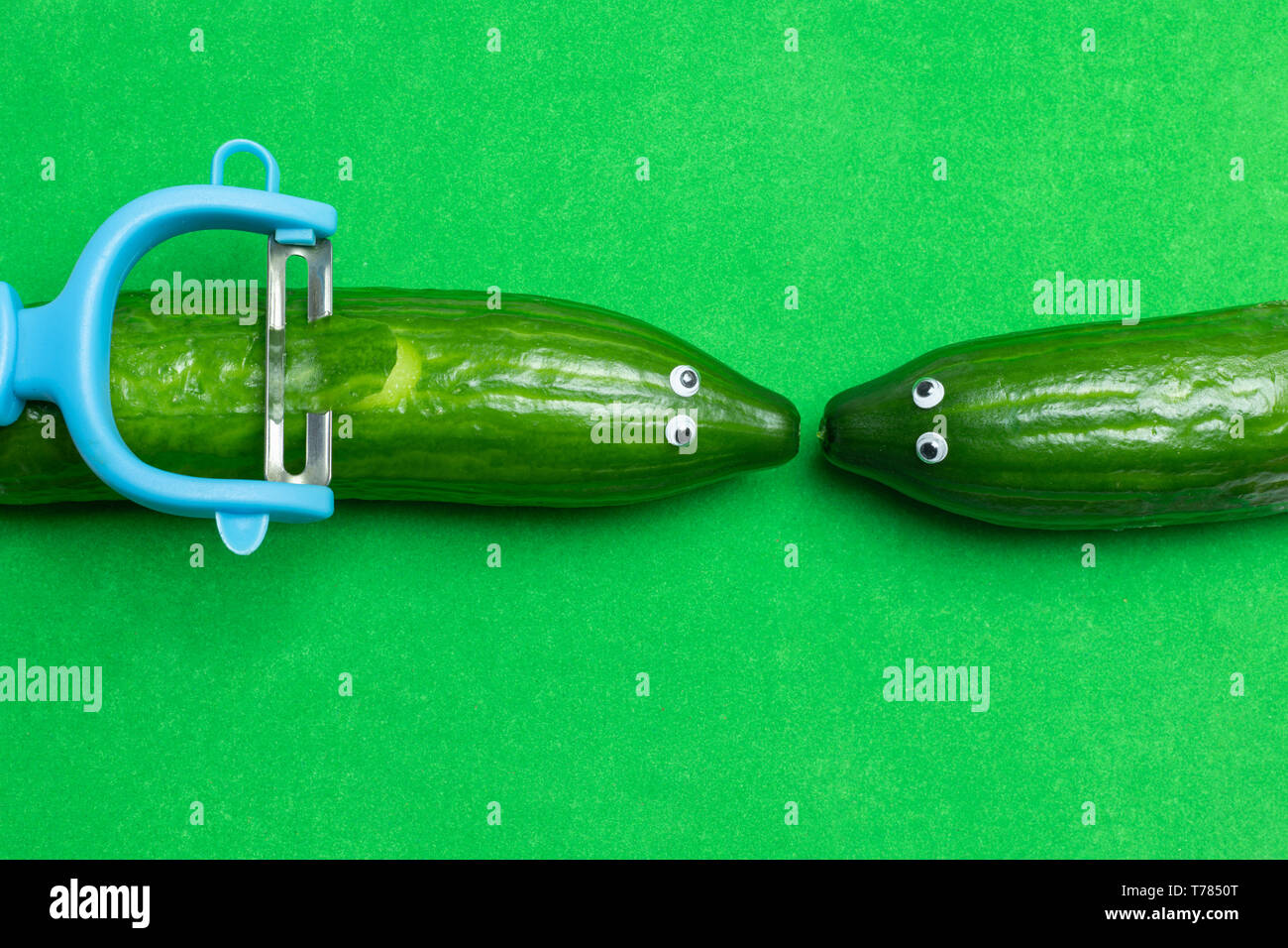 Peeling cucumber concept. Funny cucumbers with eyes and vegetable ...