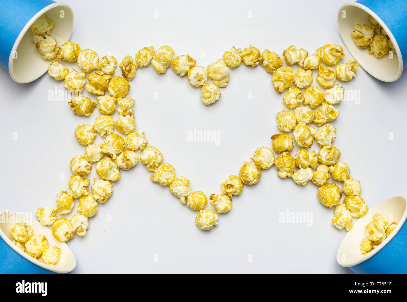 Popcorn heart shaped concept, copy space. Isolated white background ...