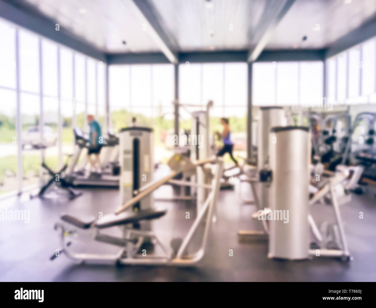 Blurry background open fitness center with people workout at new home ...