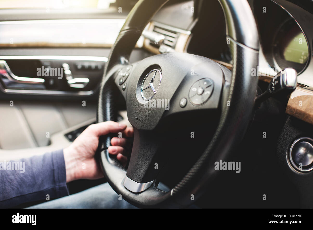 Ufa, Russia, May 11, 2018: Close-up driver's hand holds the wheel of a ...