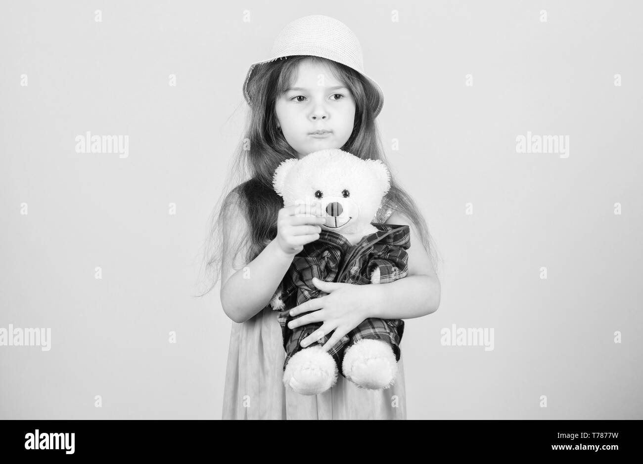 Its my toy. Small child cuddling teddy bear toy. Adorable girl child ...