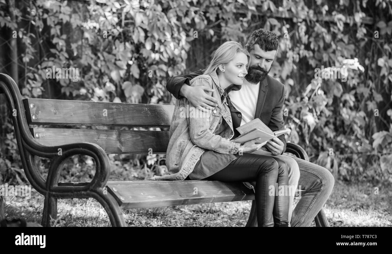 Meeting people with similar interests. Man and woman sit bench park ...