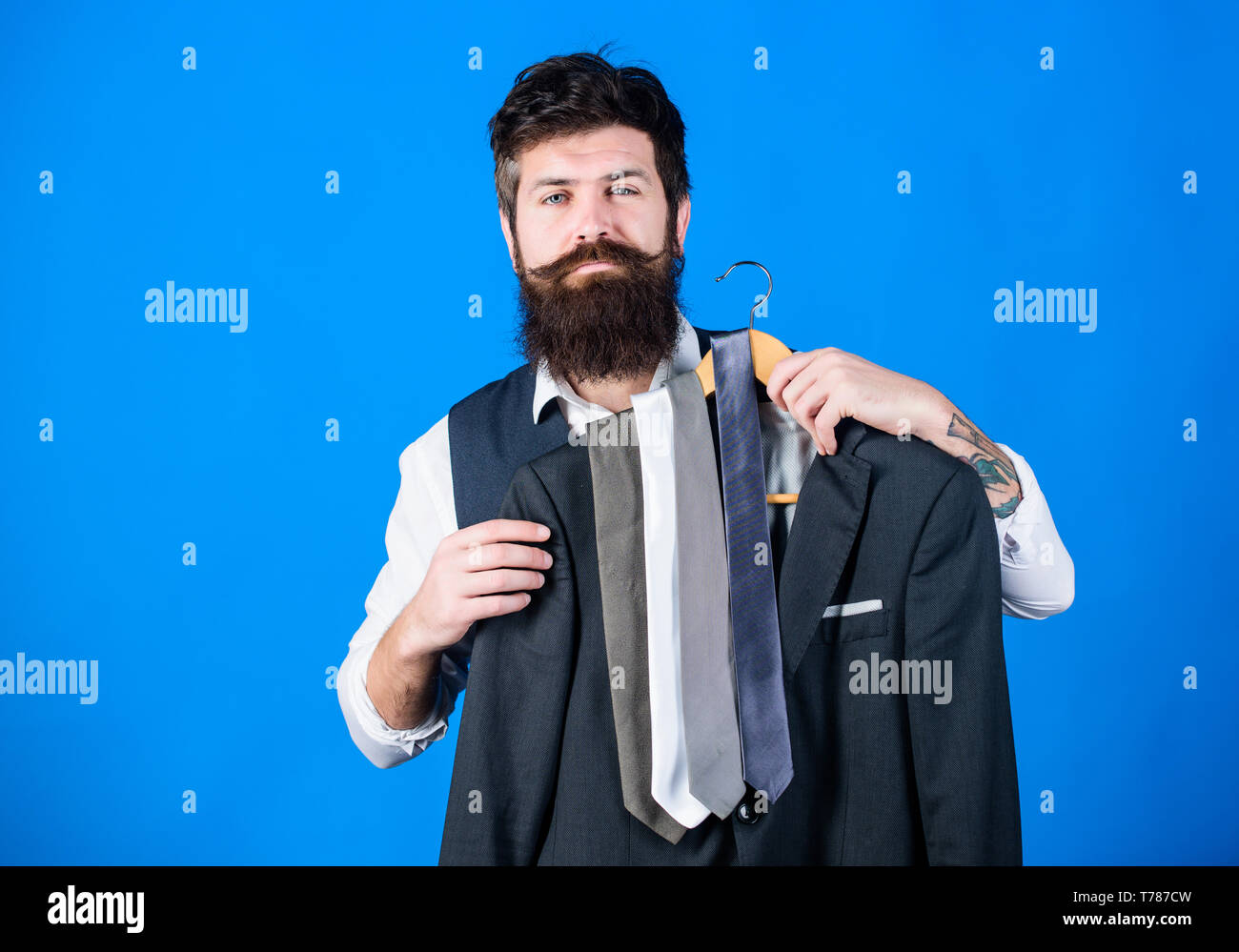 Guy choosing necktie. Perfect necktie. Shopping concept. Shop assistant ...