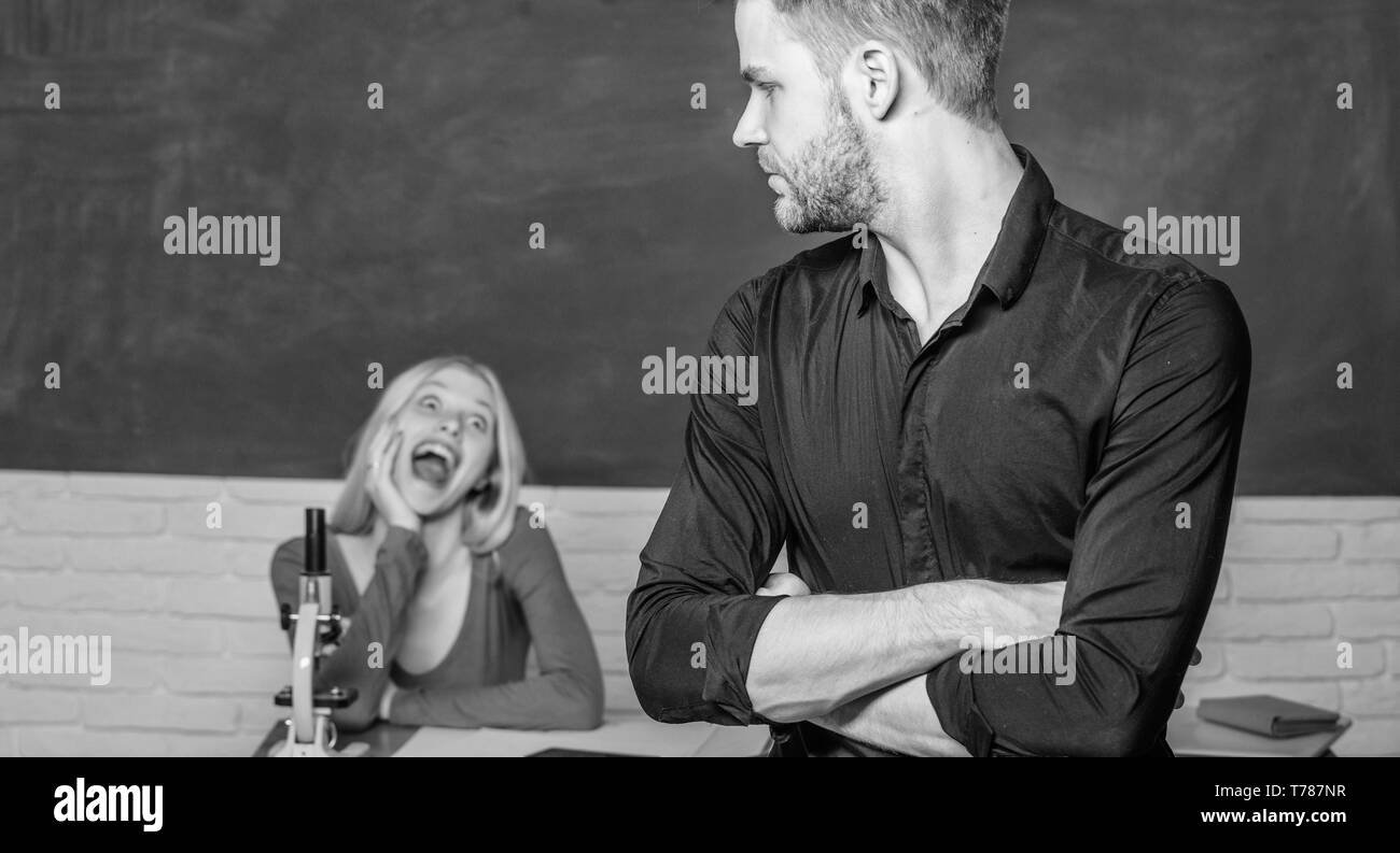 Answering home assignment. Male student with examiner at examination ...