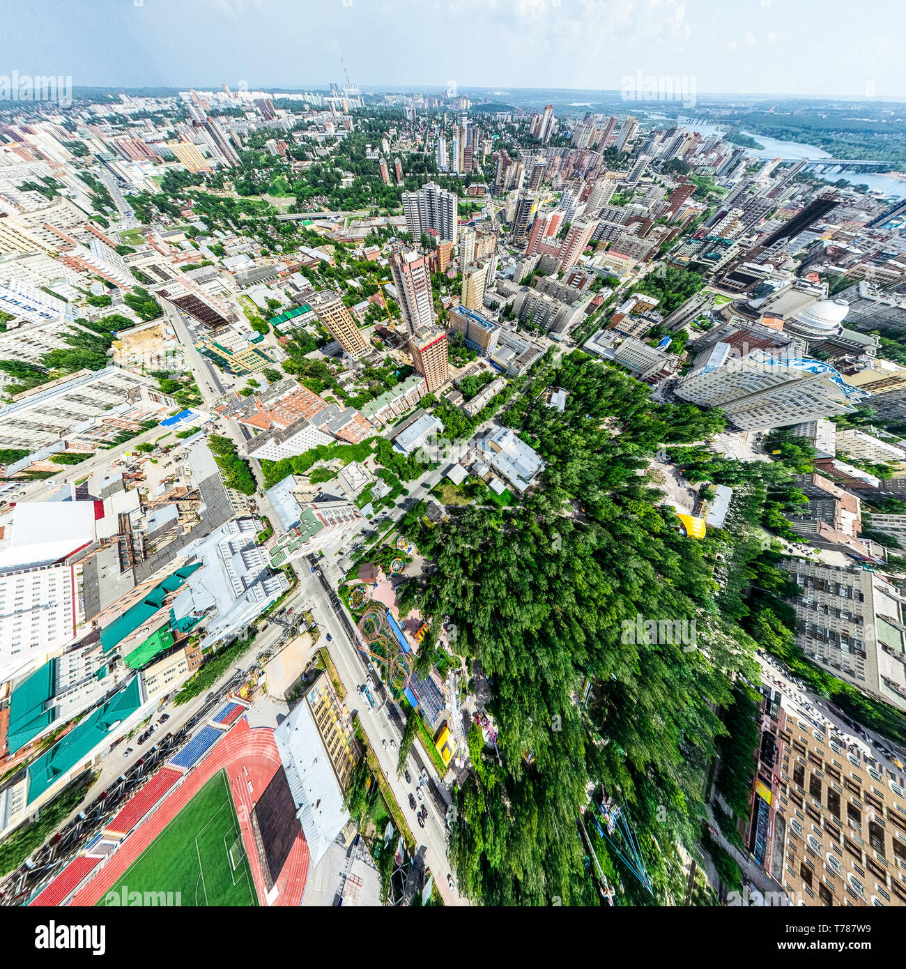 Aerial city view with crossroads and roads, houses, buildings, parks ...