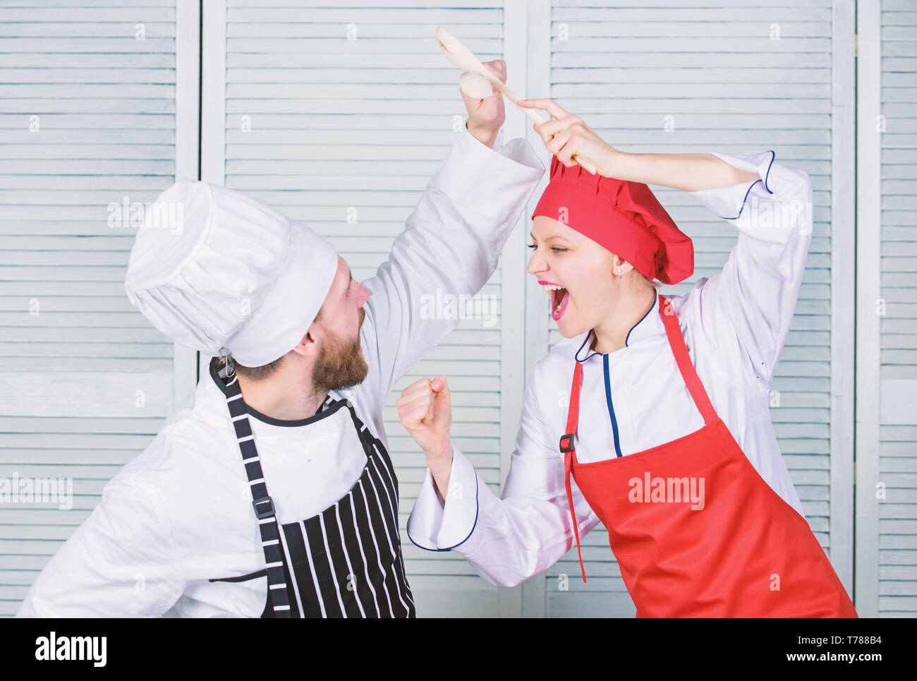 Ultimate cooking challenge. Culinary battle of two chefs. Couple ...