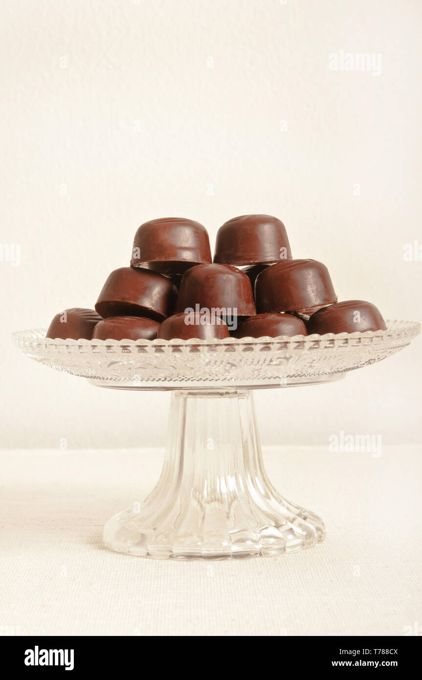 chocolate pralines on a glass stand Stock Photo - Alamy