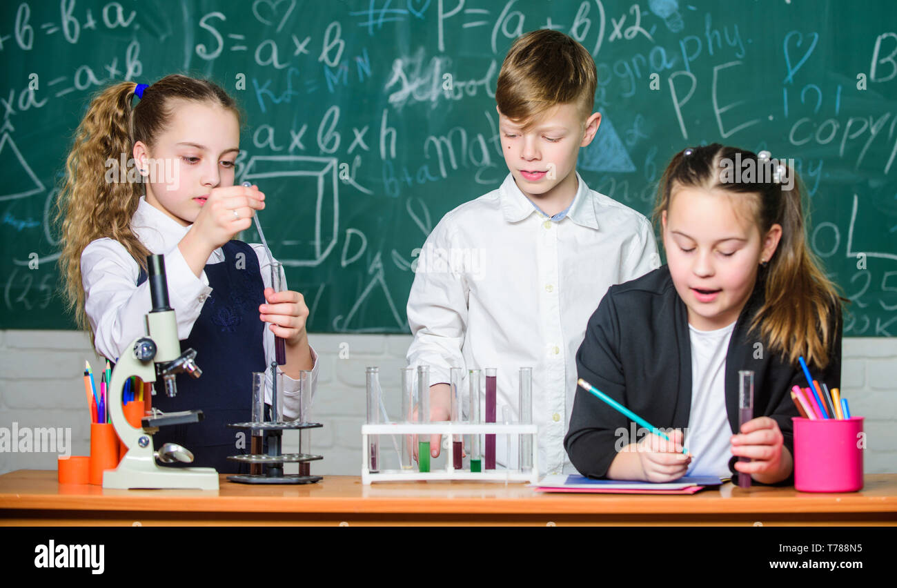 Little kids earning chemistry in school lab. biology experiments with ...