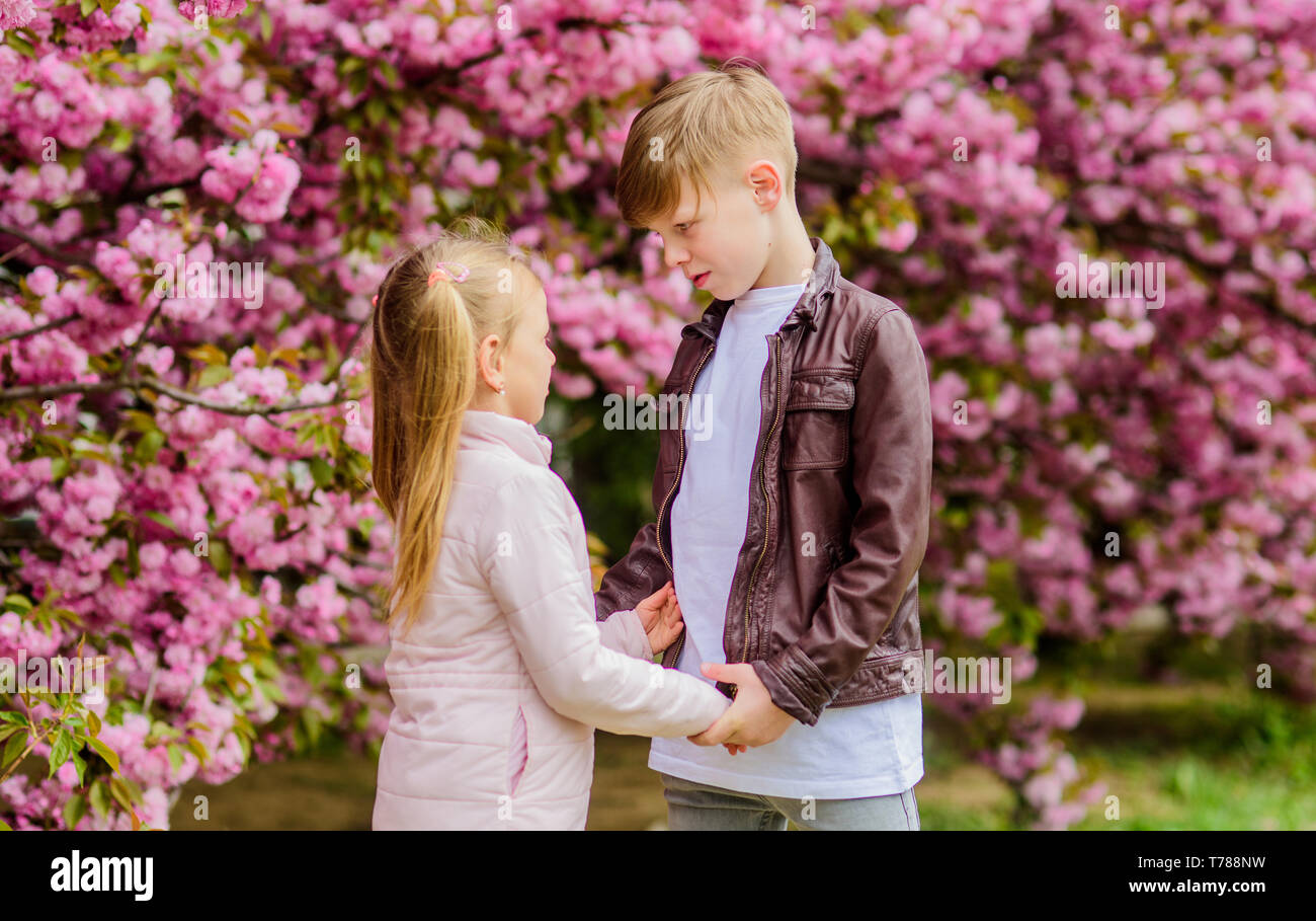 Romantic date in park. Spring time to fall in love. Kids in love pink ...