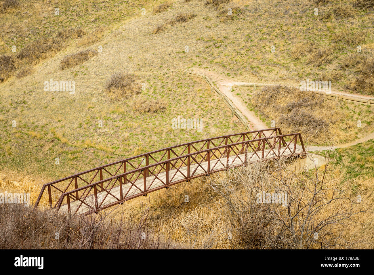 Bridge on footpath in country landscape Stock Photo - Alamy