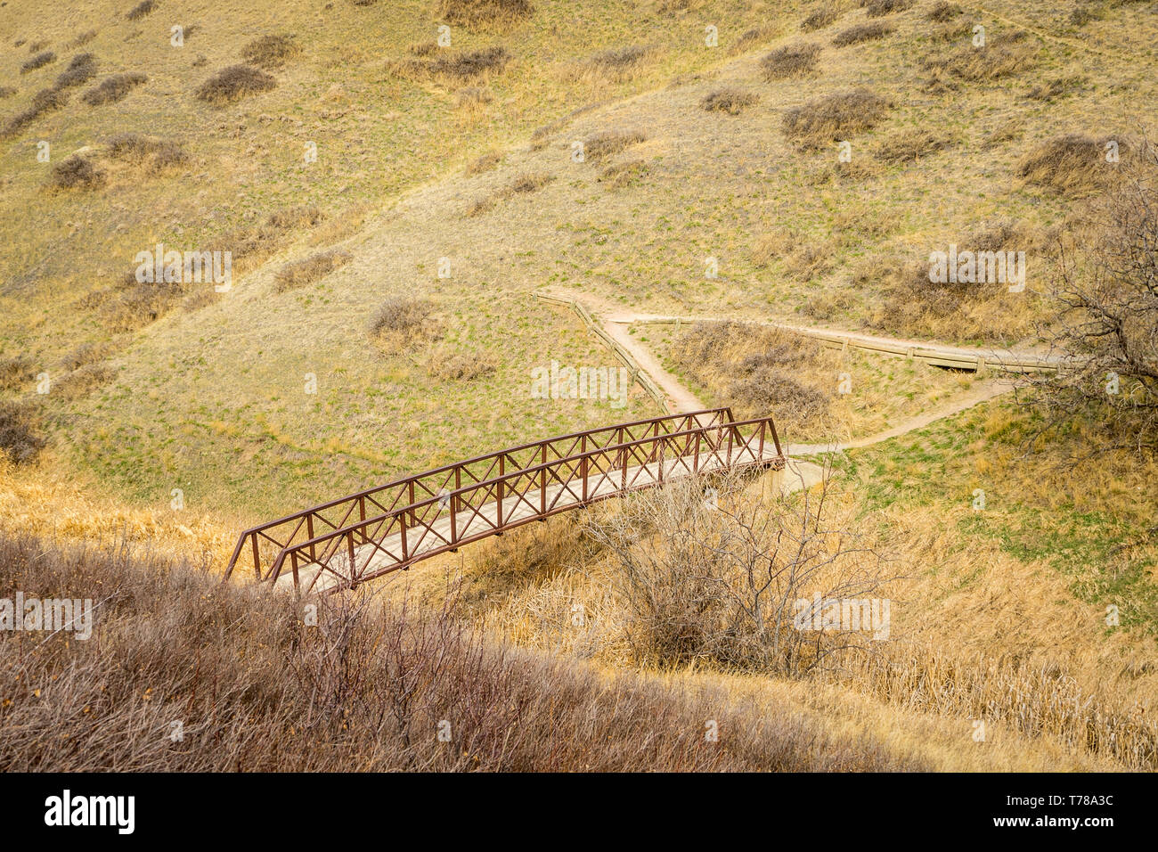 Bridge on footpath in country landscape Stock Photo - Alamy