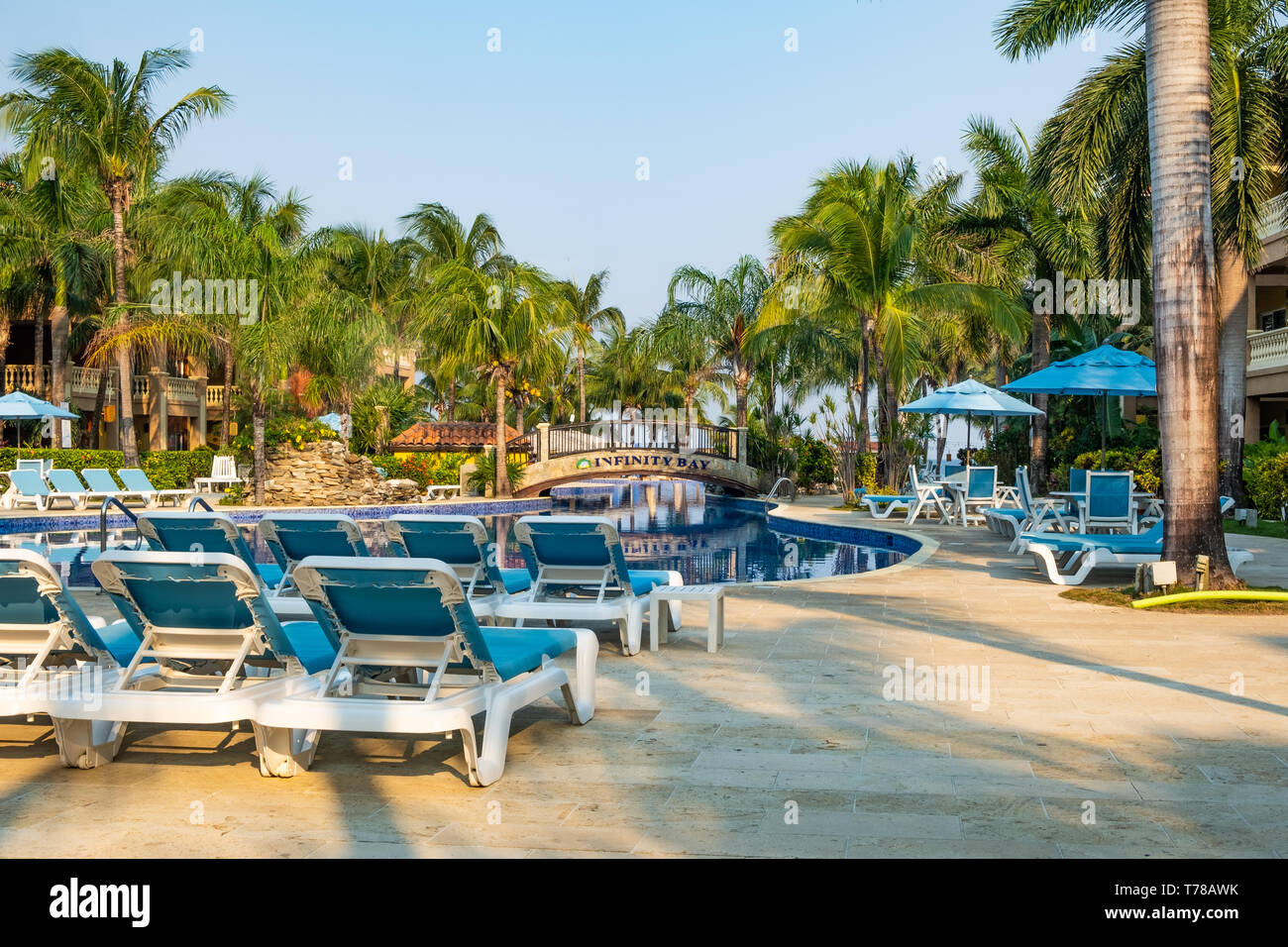The swimming pool area of Infinity Bay Spa and Resort in Roatan ...