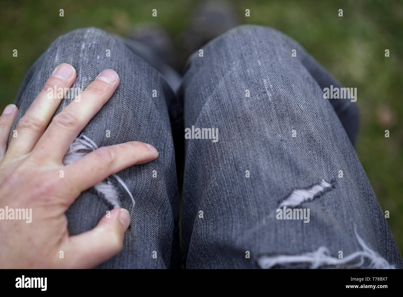 Torn jeans hi-res stock photography and images - Alamy