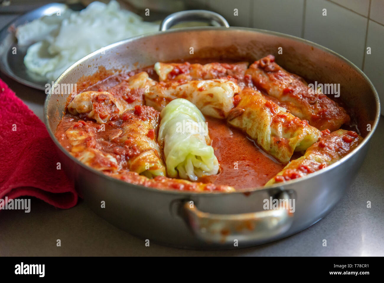Preparing stuffed cabbage with rice Stock Photo - Alamy