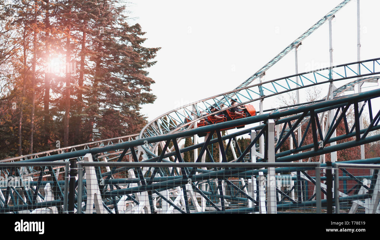A Colorful Looping Roller Coaster On A Beautiful Sunny Day Stock Photo ...