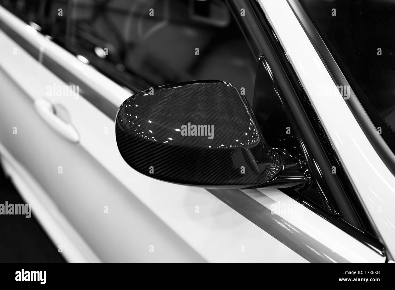 Carbon Right side Car mirror with reflection of a modern car. Car ...