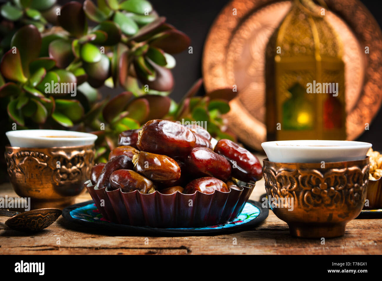 Dates served with coffee in Arabic style arrangement on a table Stock ...