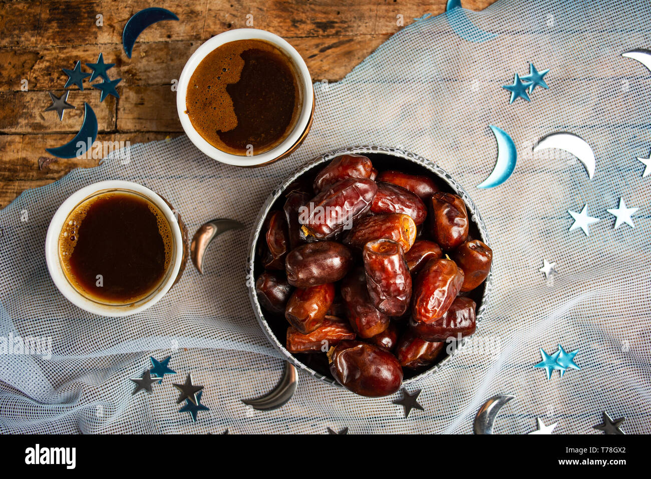 Fresh dates with coffee on a table top view Stock Photo - Alamy