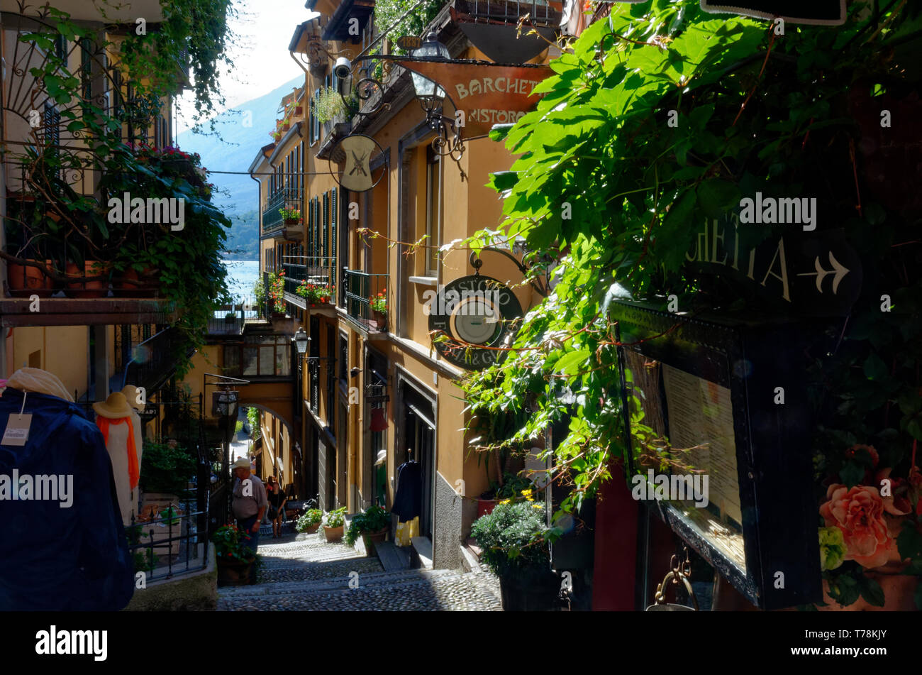 Tourists on the cobbled stairs of an elegant, if steep, alley in ...