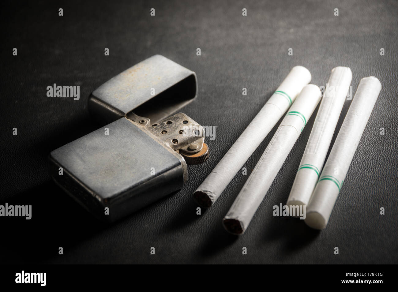 Cigarettes with old metal lighter,still life Stock Photo - Alamy