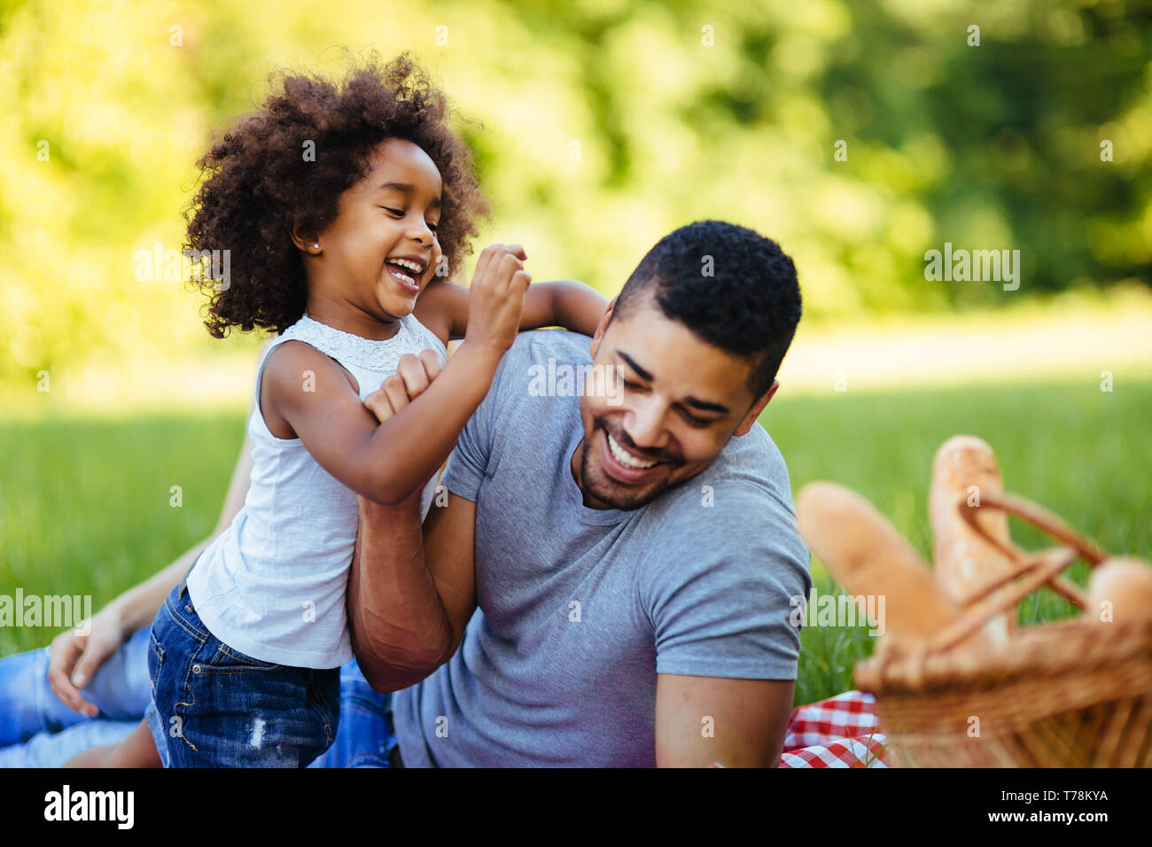 Happy family having fun time on picnic Stock Photo - Alamy