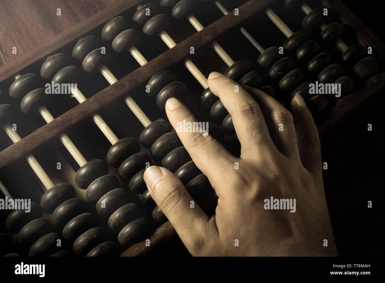 Human hand counting with abacus,sepia color Stock Photo - Alamy