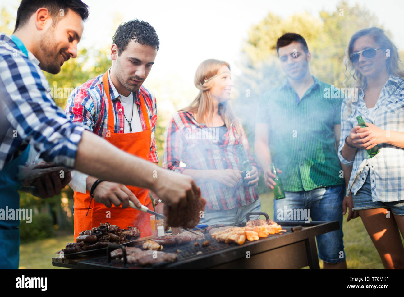 Young and happy people in nature having fun Stock Photo - Alamy