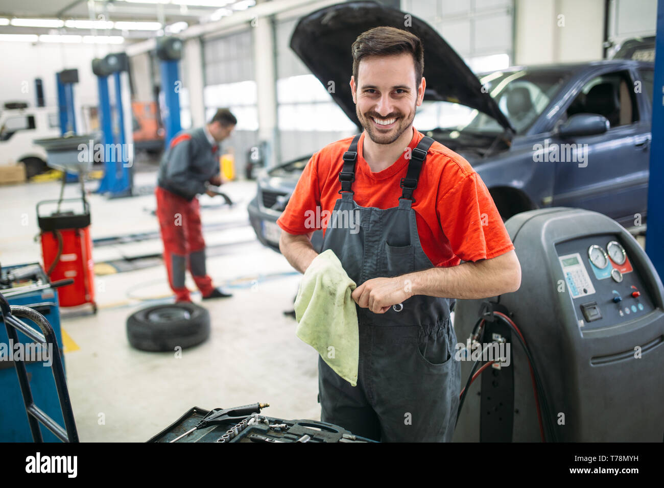 Car mechanic working at automotive service center Stock Photo - Alamy