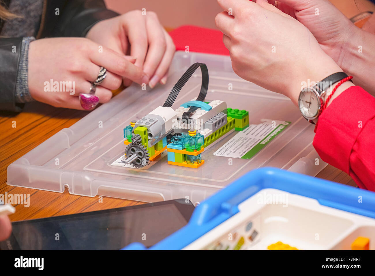 Students create a model of Lego robot Stock Photo - Alamy