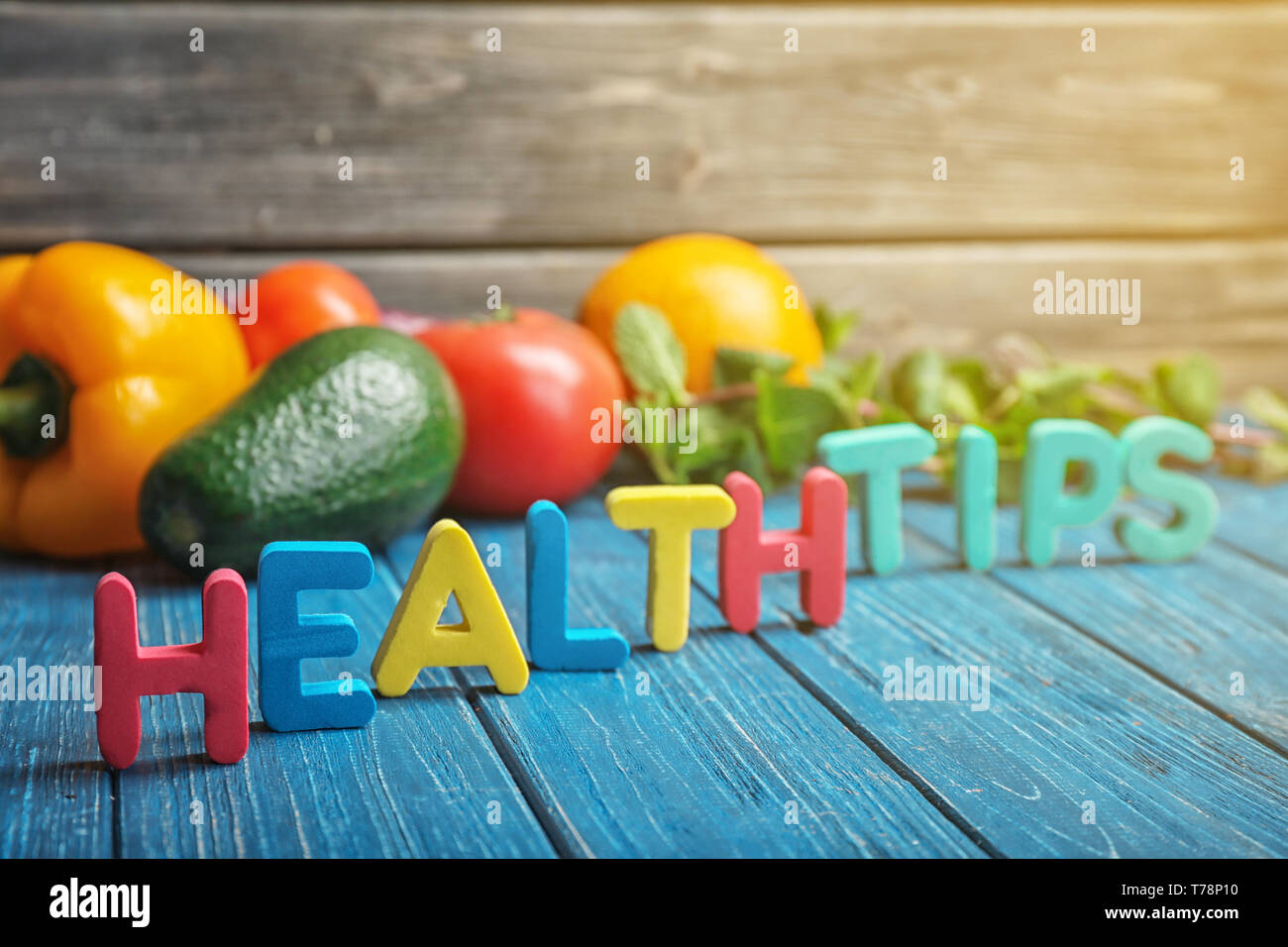 Phrase HEALTH TIPS made with color letters on wooden table Stock Photo ...