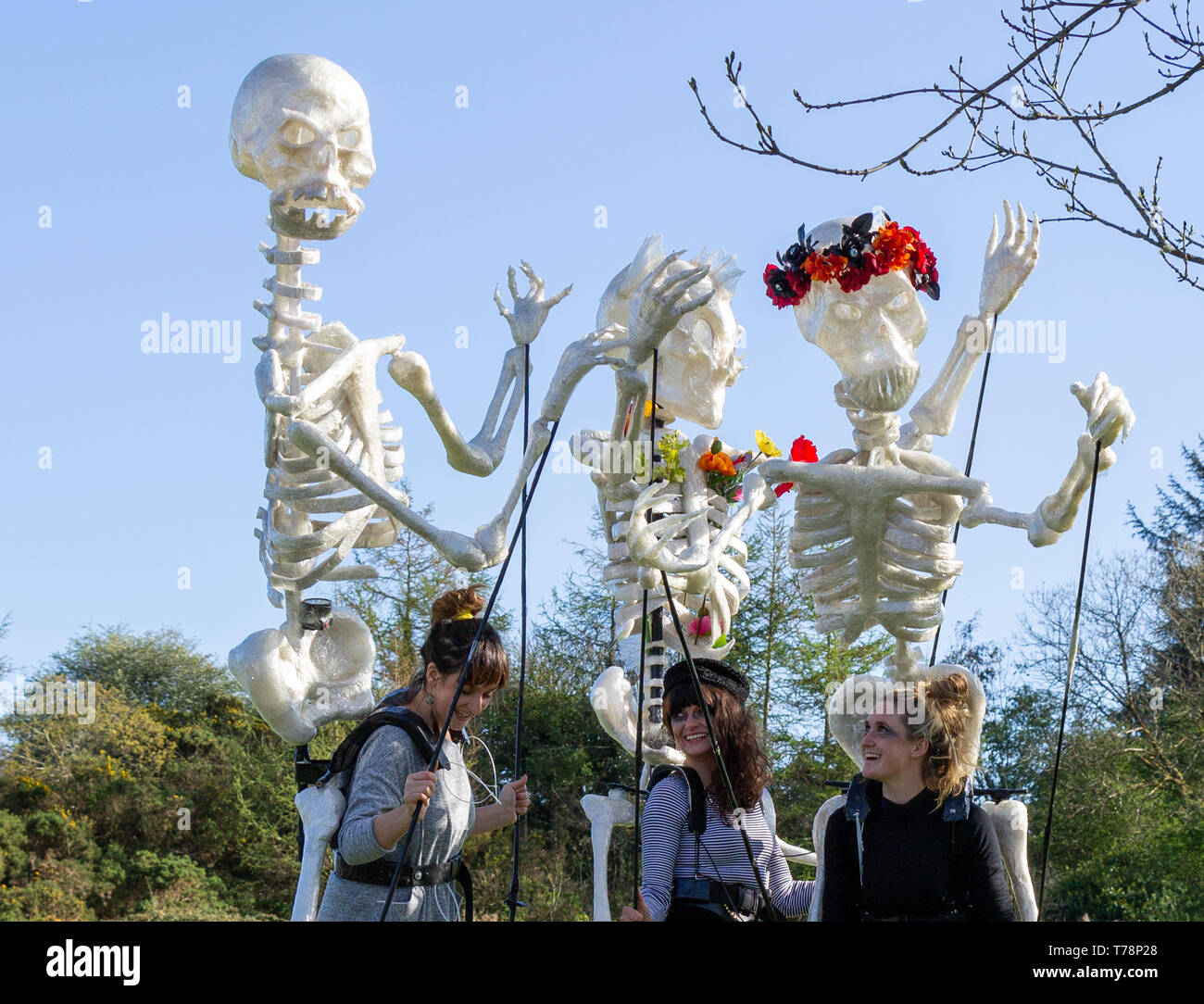 young women dancing as giant mannequin skeletons at a jazz festival ...