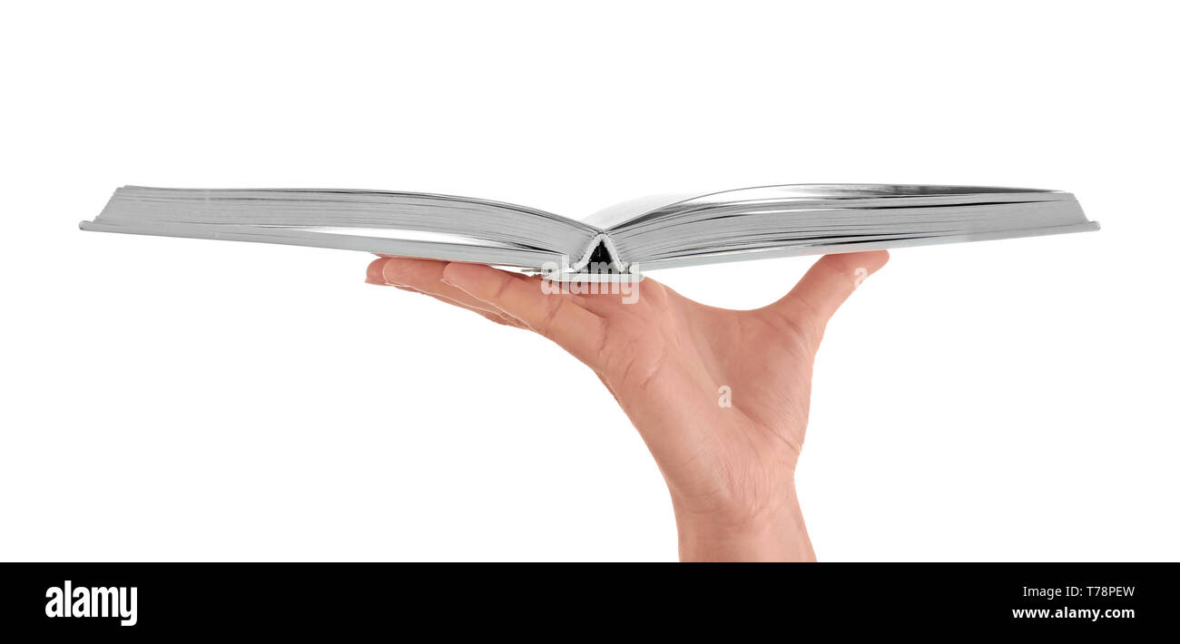Female hand holding book on white background Stock Photo - Alamy
