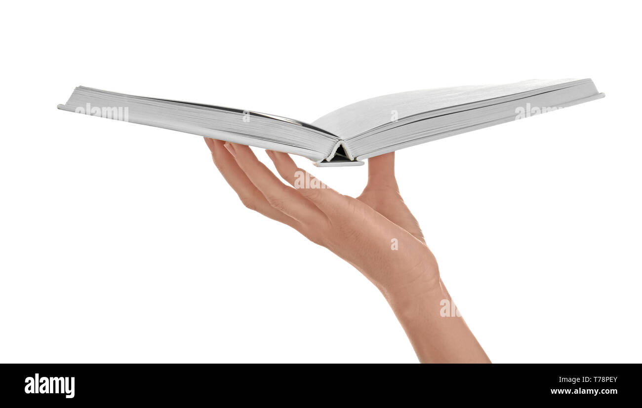 Female hand holding book on white background Stock Photo - Alamy